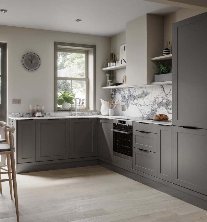 Grey kitchen units with black worktops store